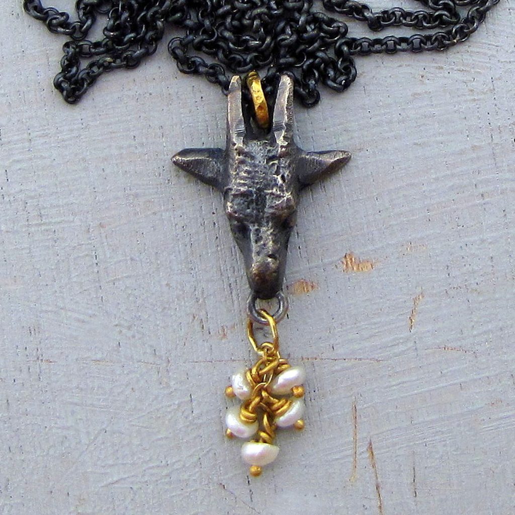 Silver goat head pendant with 22k gold and pearls on a silver chain
